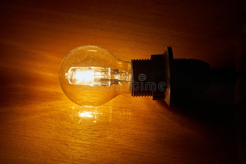Light bulb on a table stock image. Image of energy, lamp - 102394811