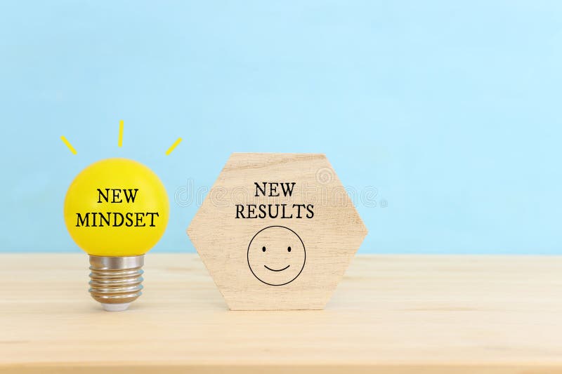 Light Bulb with the Text New Mindset in on Wooden Table Stock Photo ...