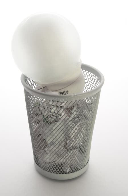 Light bulb in trash bin stock image. Image of disposed - 1340121