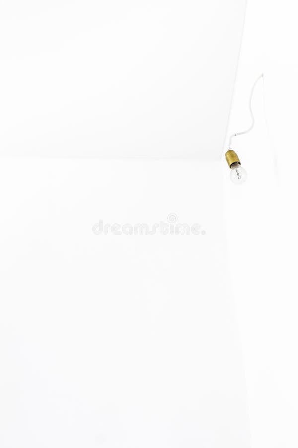 Light Bulb Turned Off Hanging on White Wall. Stock Photo - Image of ...