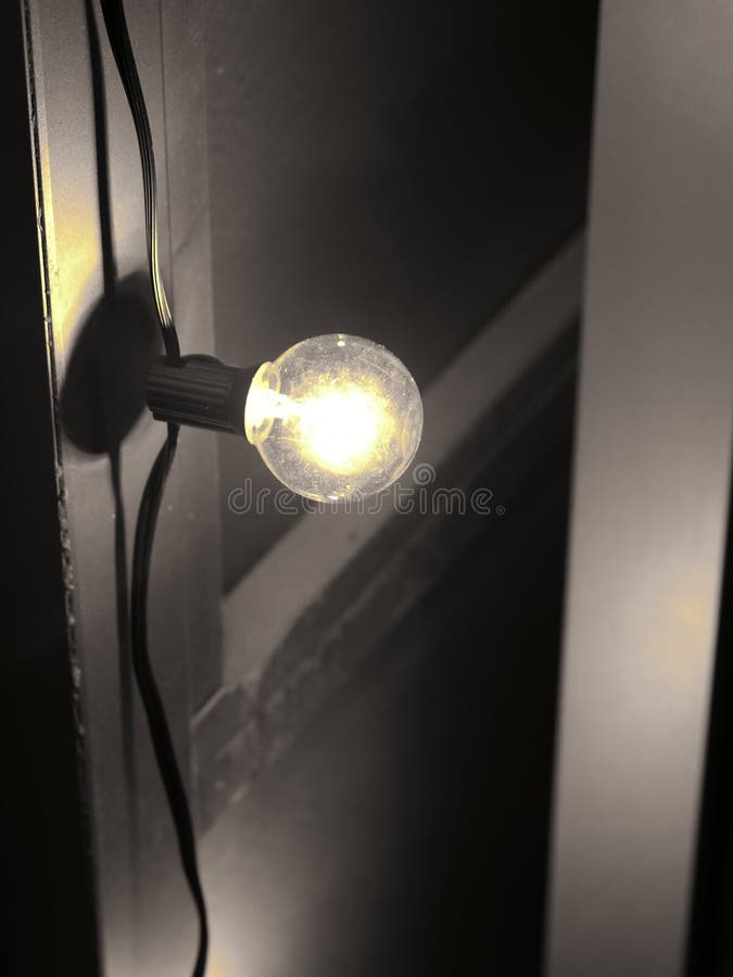 Light bulb on the wall stock photo. Image of design - 263257256