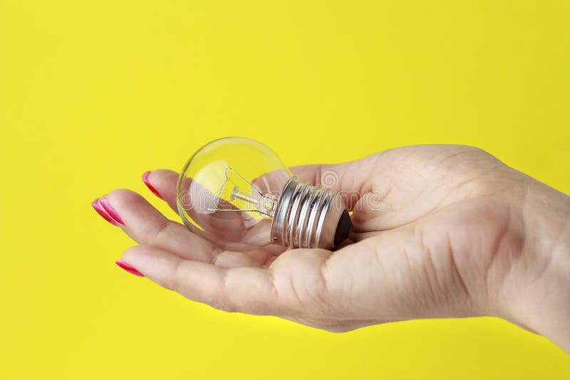 Light Bulb in a Woman`s Hand Stock Image - Image of hand, appliances ...
