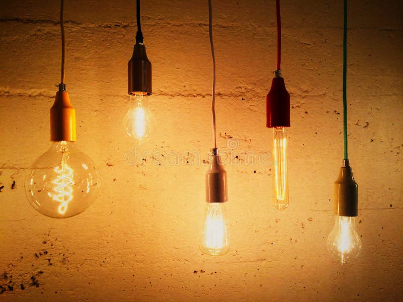 Light Bulbs Decorating a Concrete Wall Stock Photo - Image of ...