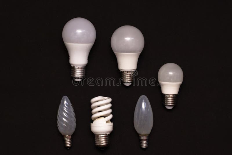 Light Bulbs of Different Types and Configurations on a Black Background ...