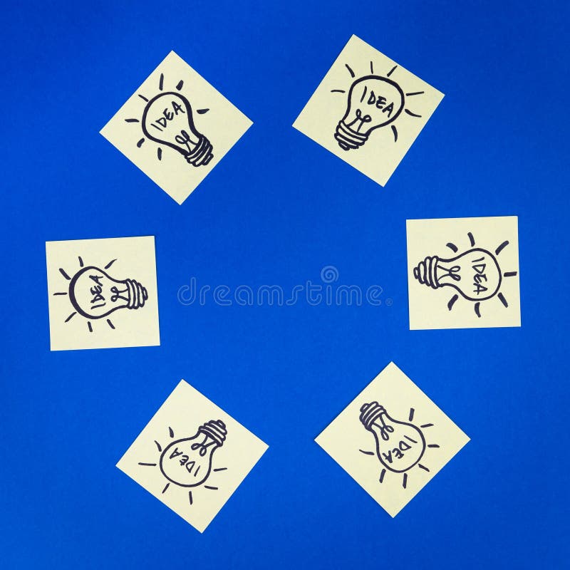 Light Bulbs Drawn on Sticky Notes Placed in a Circle with Empty Space ...