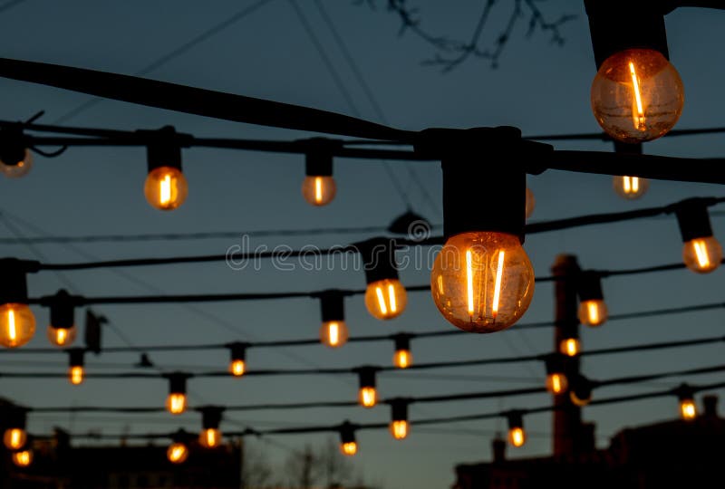 Light Bulbs on the Evening Blue Sky Stock Image - Image of lights ...