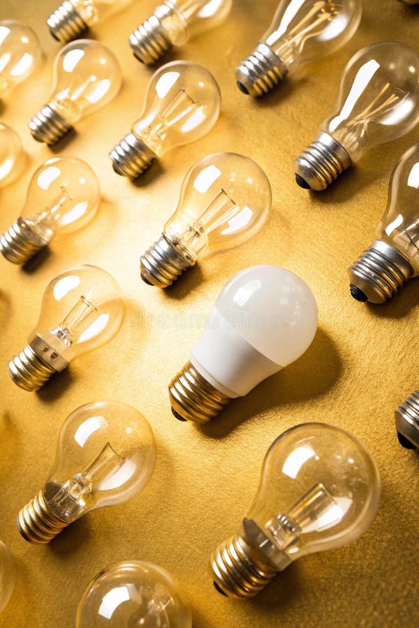 Light Bulbs on Golden Background for High Resolution Wallpaper Stock ...