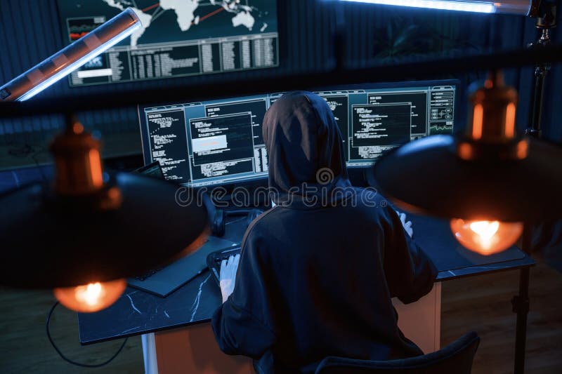 A Lot of Information on Displays. Young Professional Female Hacker is ...