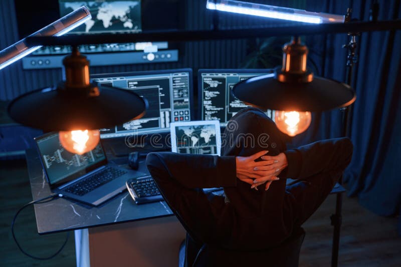 Light Bulbs. Young Professional Female Hacker is Indoors by Computer ...