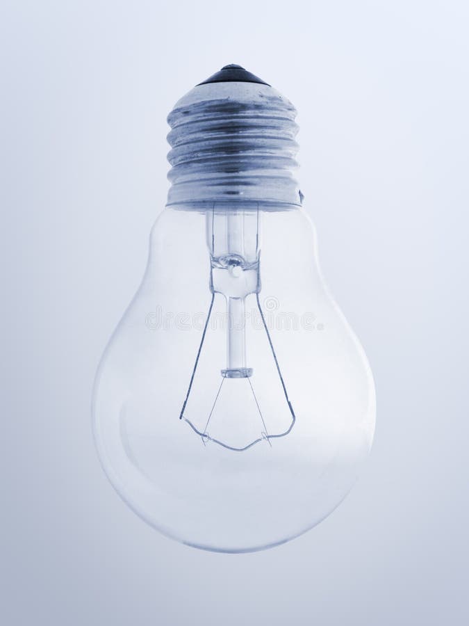Light Bulb in Plate and Fork and Spoon on Wooden Table Stock Photo ...