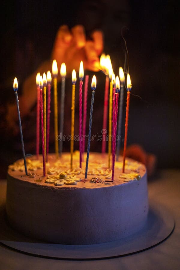 Light Candles on a Birthday Cake in Honor of a Birthday Party Stock ...