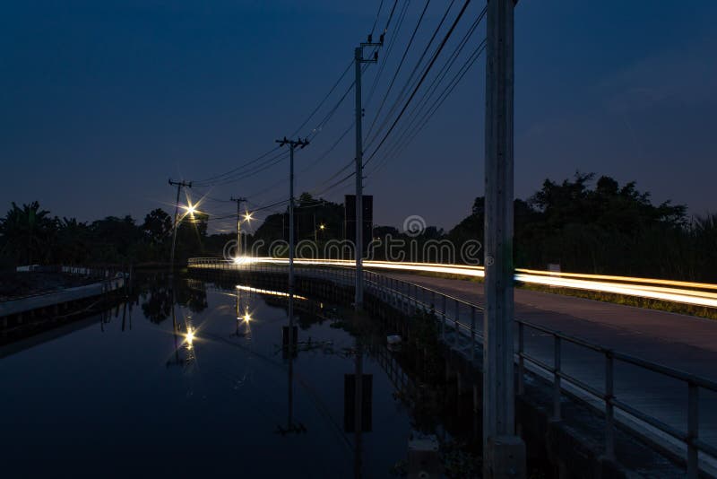 The Light from the Car and Roadside Lamp Reflecting Surface. Stock ...