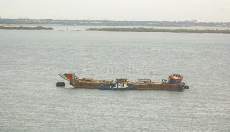 A Light Cargo Vessel and a Tug Off the Coasts of Cebu City Philippines ...