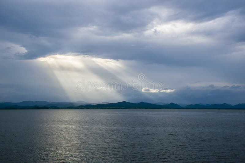 Light through the clouds stock photo. Image of light - 123947226