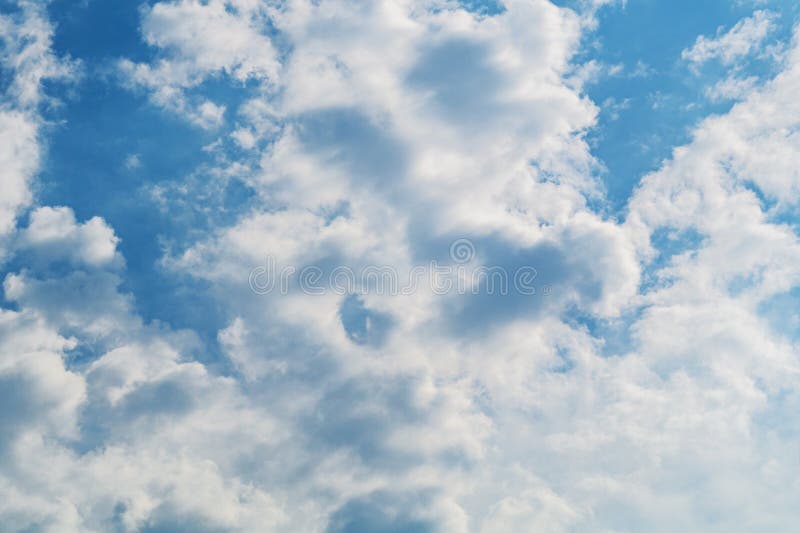 Light Clouds with Sun Rays Against the Background of a Blue Clear Sky ...