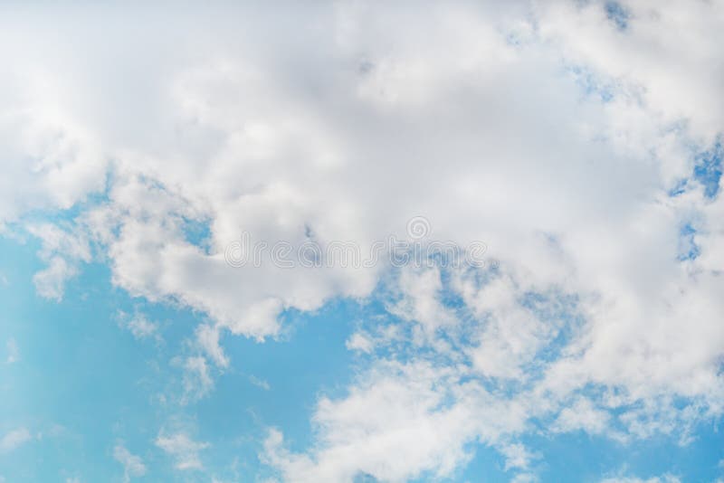 Light Clouds with Sun Rays Against the Background of a Blue Clear Sky ...