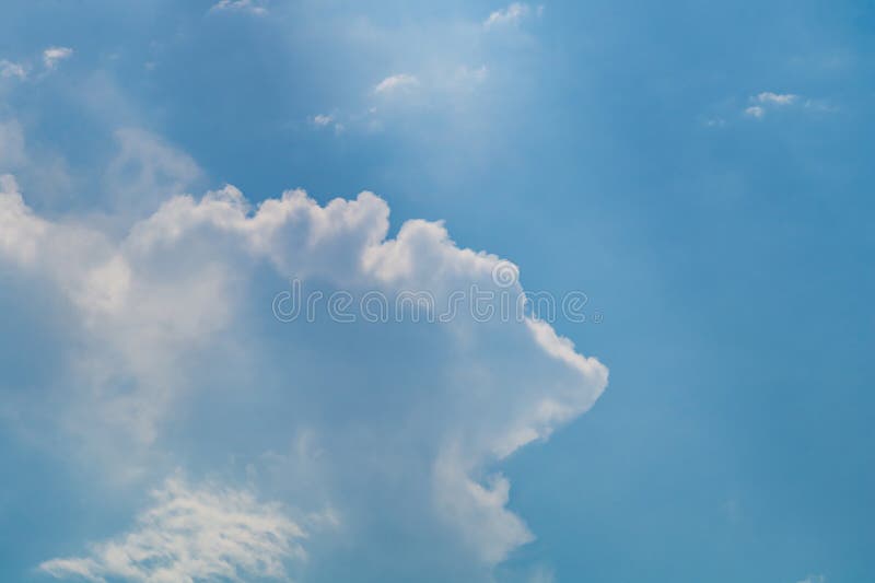 Light Clouds with Sun Rays Against the Background of a Blue Clear Sky ...