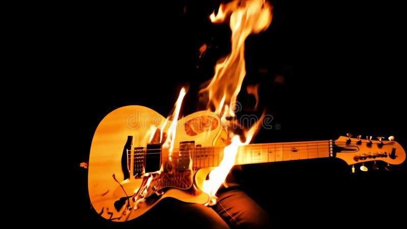 A Light-colored Electric Guitar is Shown Burning in a Dark Setting ...