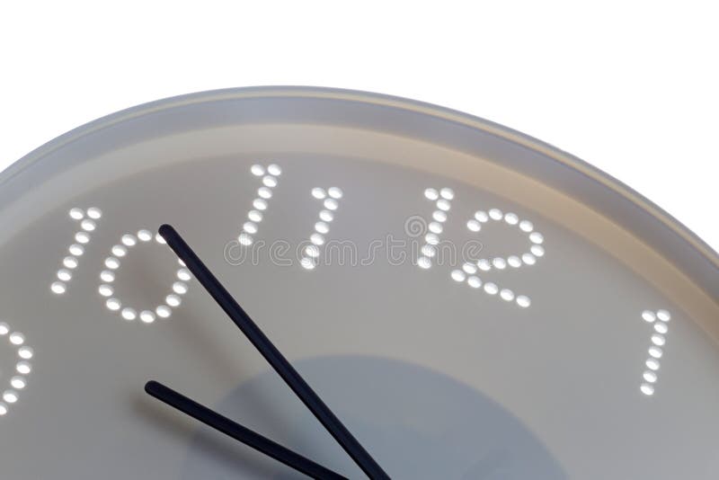 Light Comes through White Wall Clock with Perforated Numbers Stock ...
