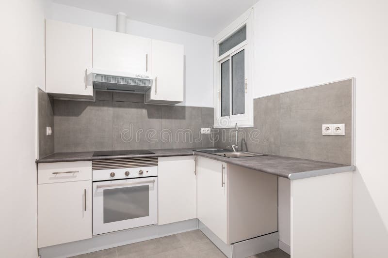 Light Compact Kitchen with Stove, Extractor Hood and Sink and Window ...