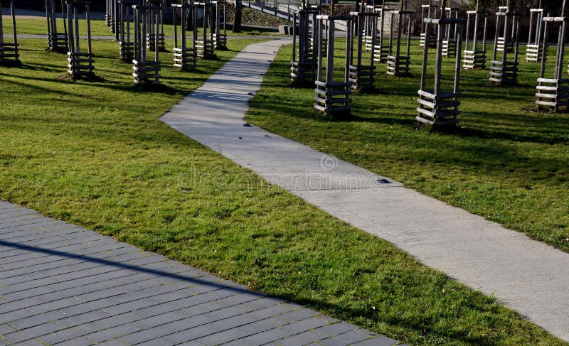 Light Concrete Path through the Park. the Crooked Line of the Path in ...