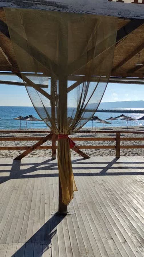 Light Curtains Flutter in the Wind on an Empty Outdoor Patio on the ...