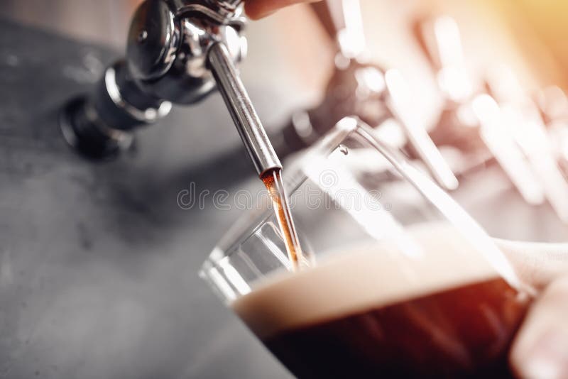 Light Draft Cold Beer Pour in Glass from Crane in Pub Stock Photo ...