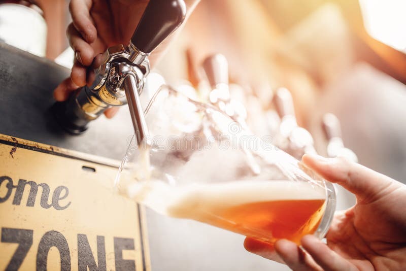 Light Draft Cold Beer Pour in Glass from Crane in Pub Stock Image ...
