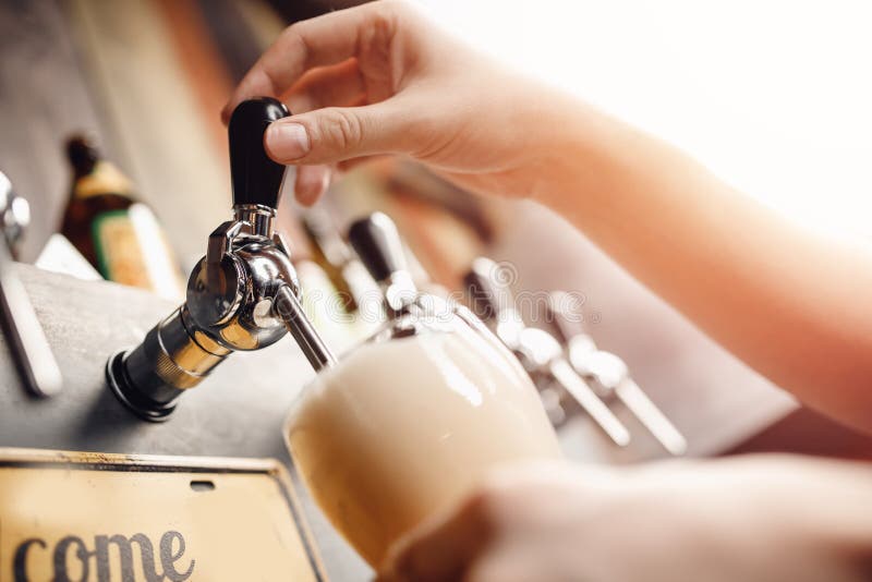 Light Draft Cold Beer Pour in Glass from Crane in Pub Stock Photo ...