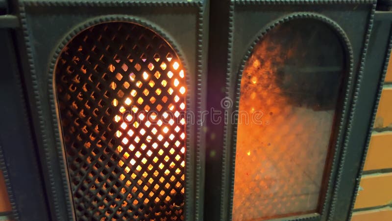 Light Effect of Lens Flare from Burning Fire Flames in Fireplace Behind ...