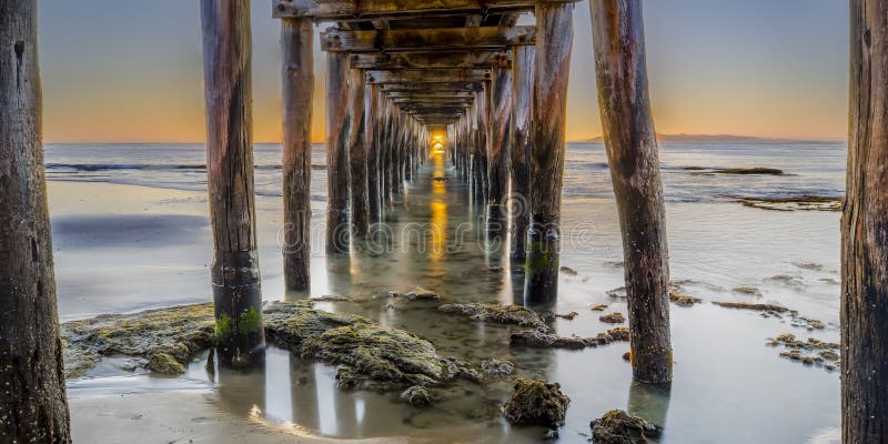 Light at the End of the Jetty Stock Photo - Image of lonsdale, pylon ...