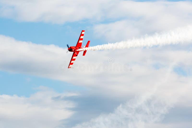 Light Engine Airplane with a Trace of White Smoke Stock Photo - Image ...