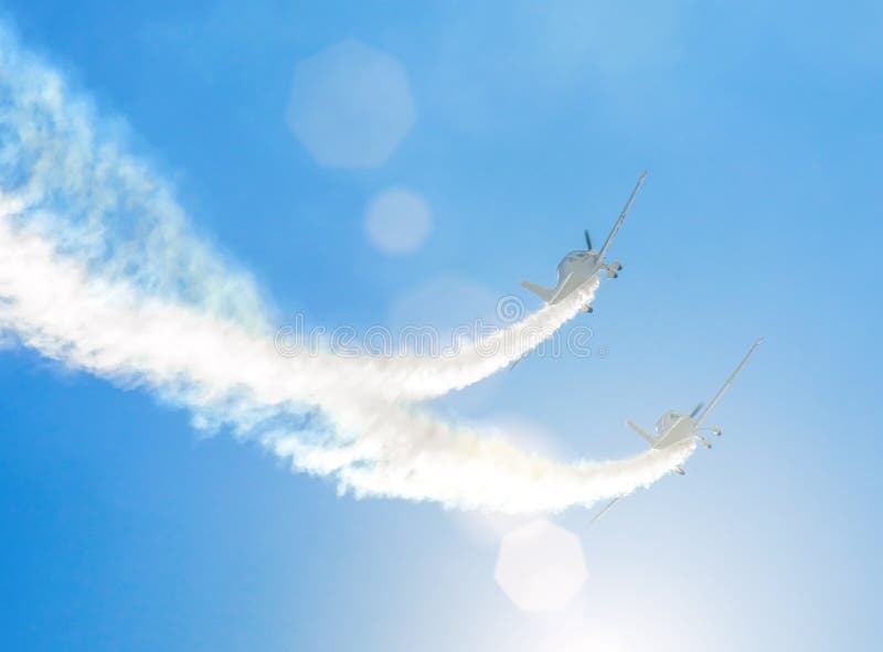 Light Engine Airplane with a Trace of White Smoke Fly in Groups in the ...