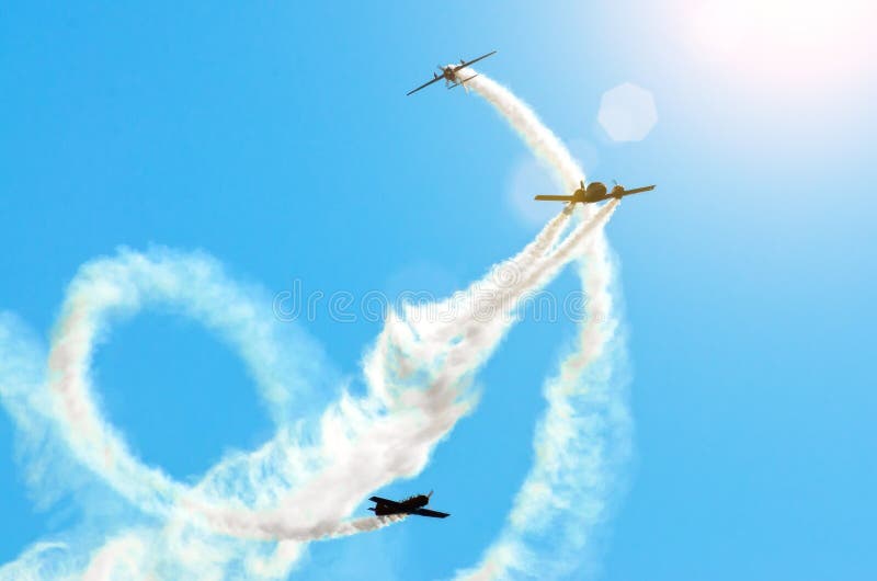 Light Engine Airplane with a Trace of White Smoke Fly in Groups in the ...