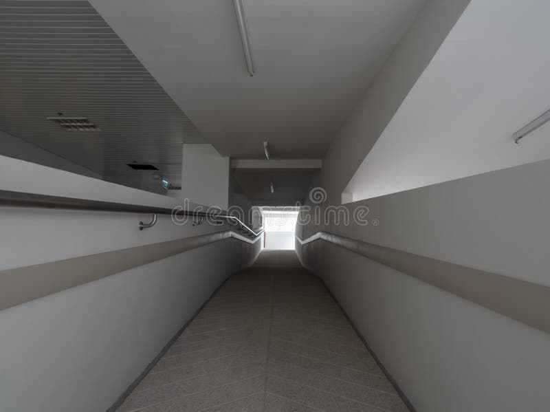 Light at the Exit of the Corridor in the Building Stock Photo - Image ...