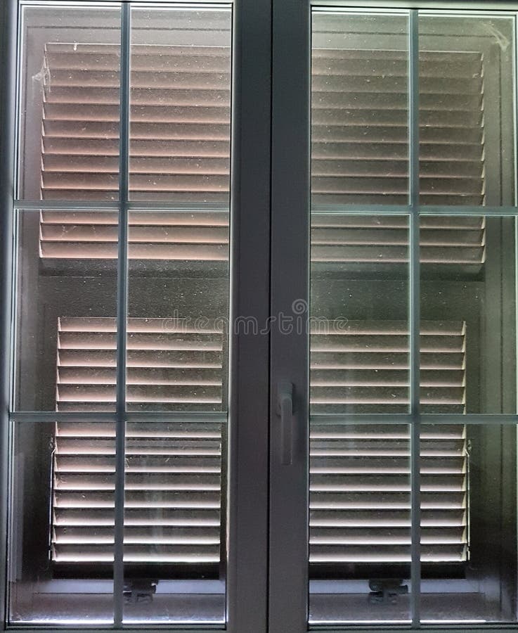 Light That Filters Between The Closed Shutters Stock Photo - Image of ...