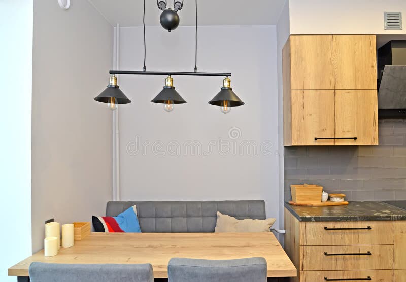 Light Fixture Above the Dining Table in the Kitchen. Modern Minimalism ...