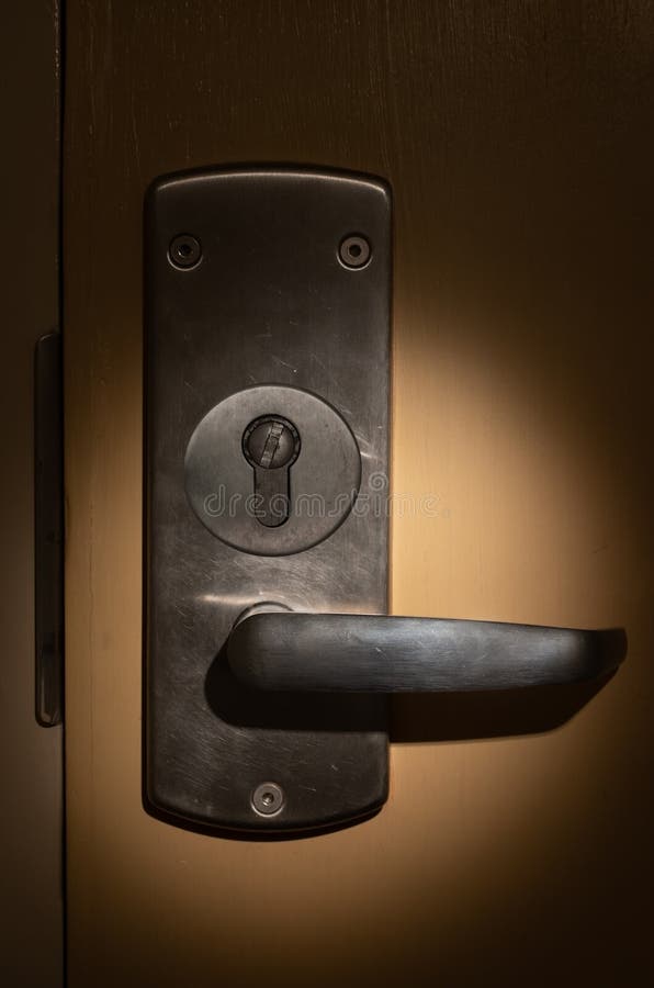 The Light of the Flashlight on the Closed Door Lock Stock Photo - Image ...