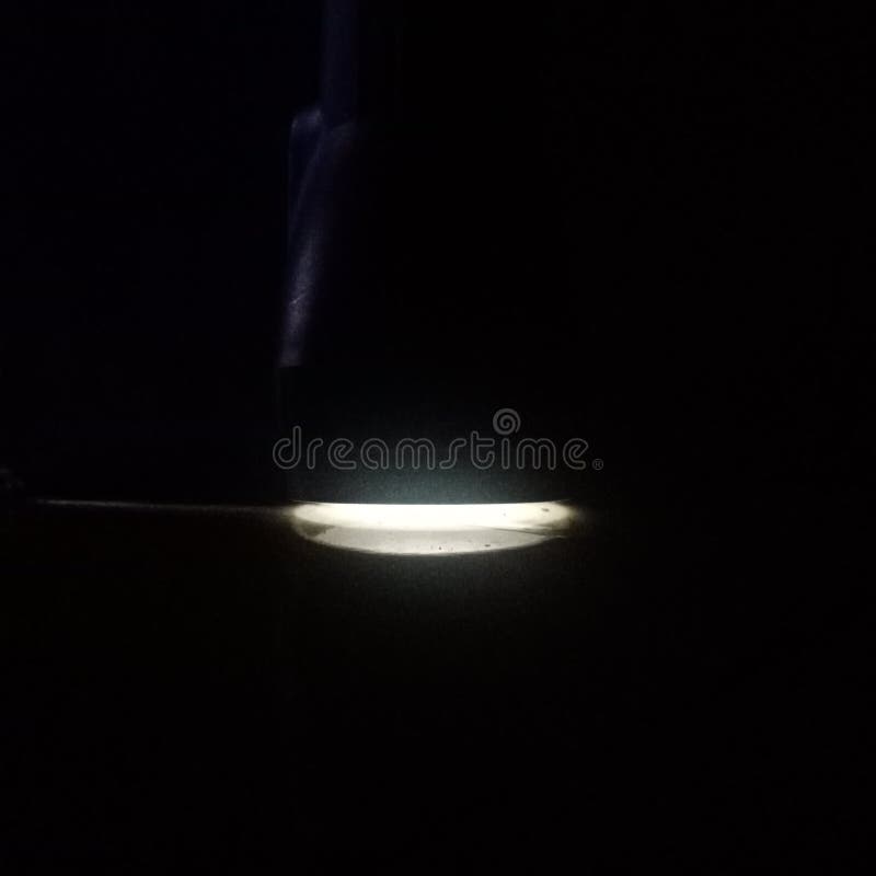 The Light from the Flashlight Striking the Room Was Pitch Black Stock ...