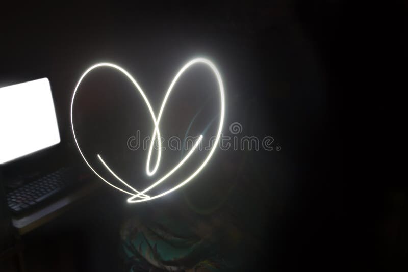 Light Forming a Love Symbo in a Dark Place Stock Image - Image of ...