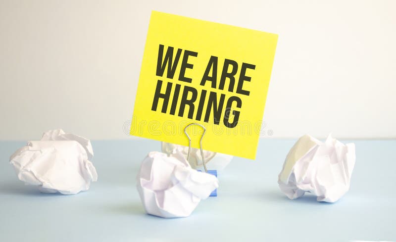 On a Light Gray Background, a Notebook, a Blue Pen and a Sheet of Paper ...