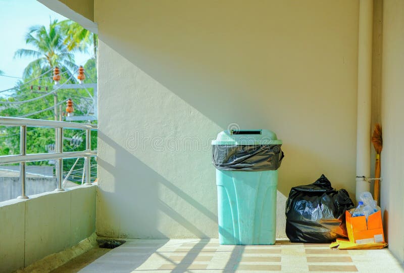 Light Green Garbage Bin on the Walkway in the Building Stock Photo ...