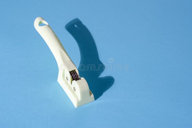 Light Green Knife Sharpener on Blue Background Stock Image - Image of ...