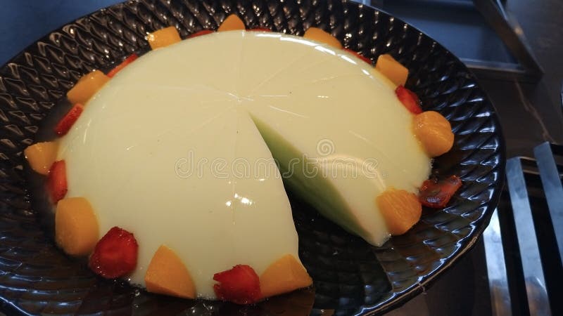 Light Green Pudding with Mango and Strawberry Topping Stock Photo ...