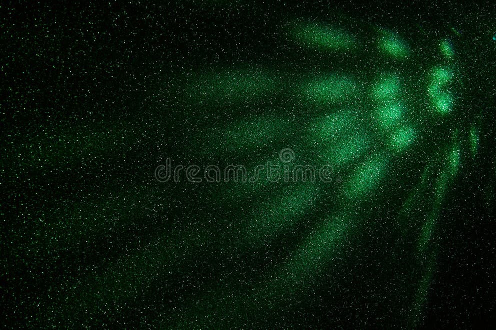 Light Green Rays of Light on a Dark Green Finely Grained Background ...