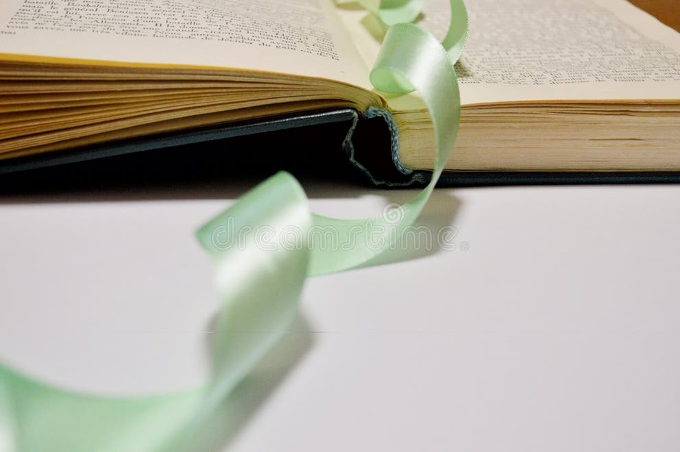 Light Green Ribbon Bookmark in a Book Stock Photo - Image of invitation ...