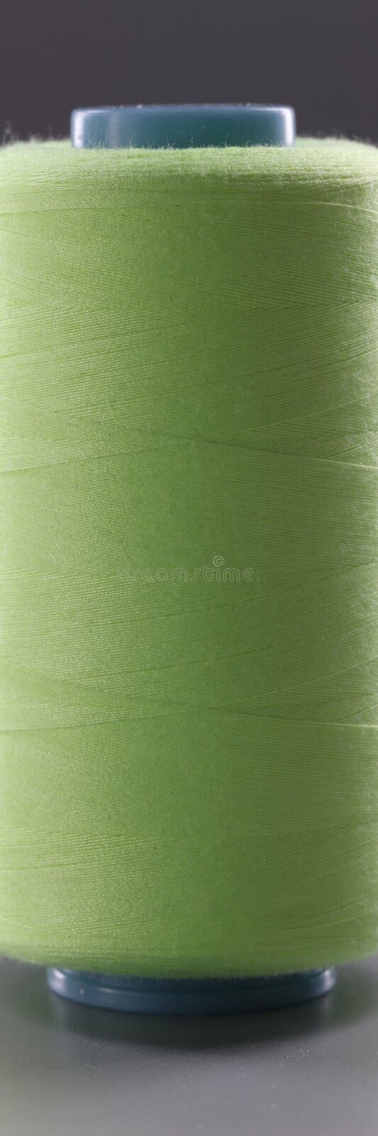 Light Green Spool of Thread on Gray Background Stock Photo - Image of ...
