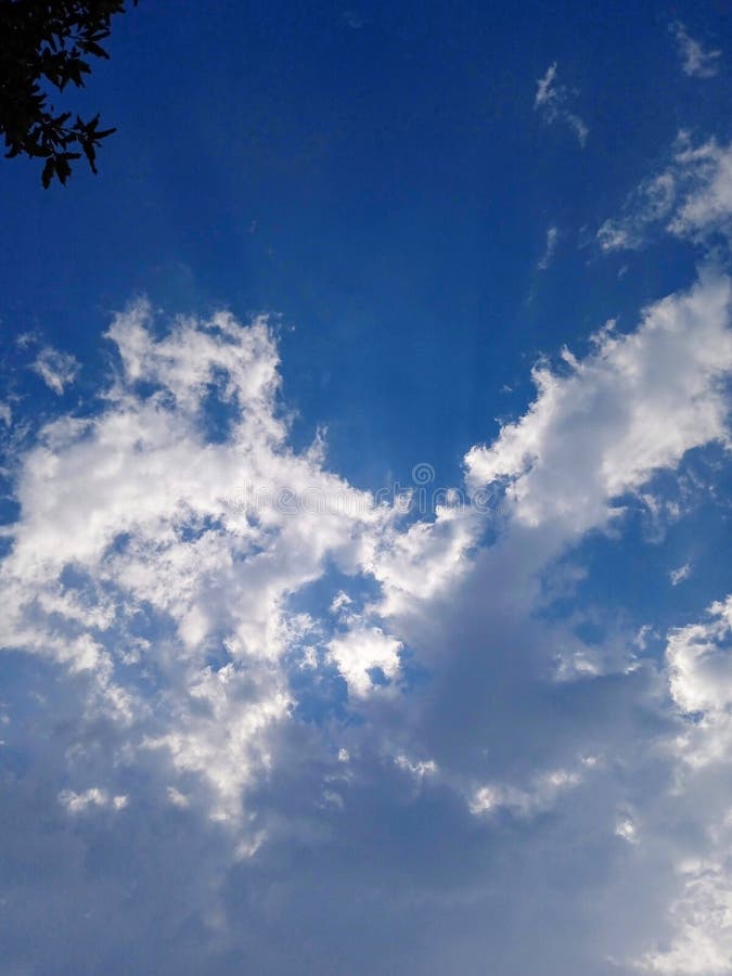 Light Grey Clouds on Blue Sky Illuminated by Sunlight from Behind Stock ...