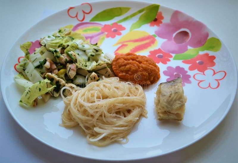 Light and Healthy Lunch with Vegetables,fish and Zucchini Pasta. Stock ...