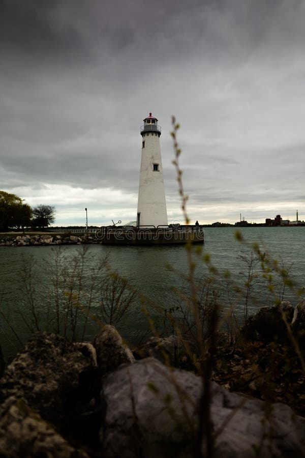 Light House at the End of Pier on a Cloudy Day Stock Photo - Image of ...